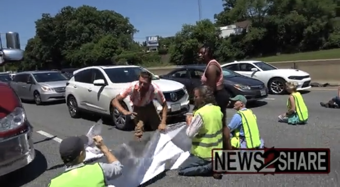 Watch: Agitated driver got physical with climate protestors for ...